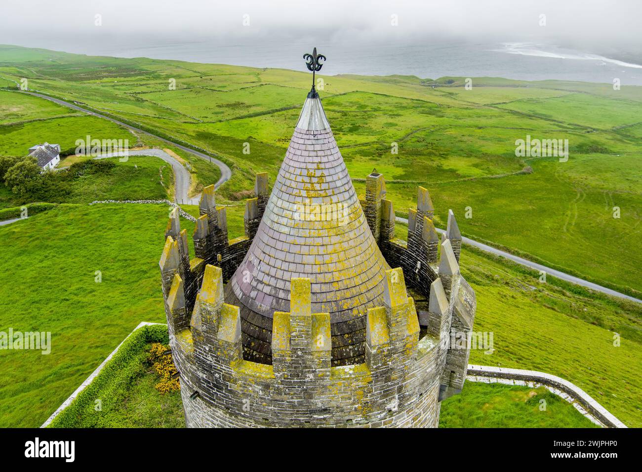 Aerial view of Doonagore Castle, round 16th-century tower house with a ...
