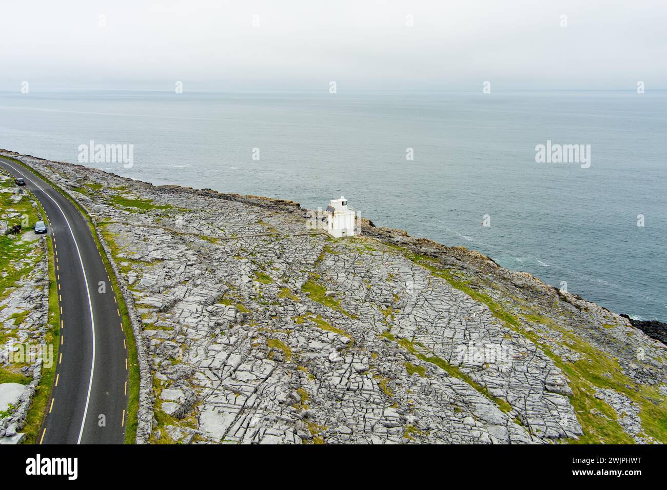 Black Head Lighthouse, situated in the rough rocky landscape of Burren ...