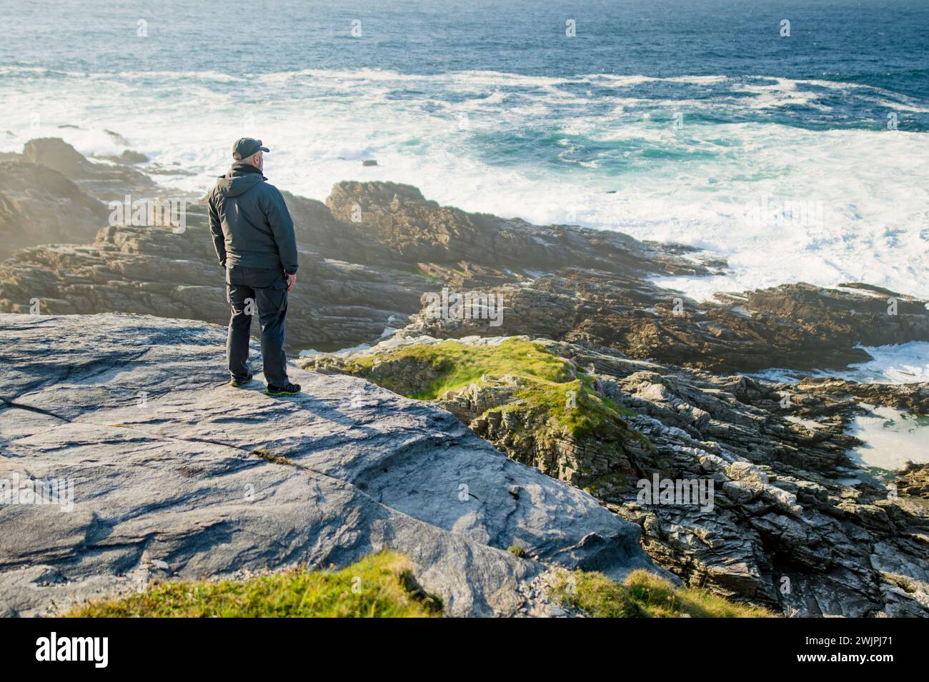 Tourist admiring scenic beauty of Malin Head, Ireland's northernmost ...