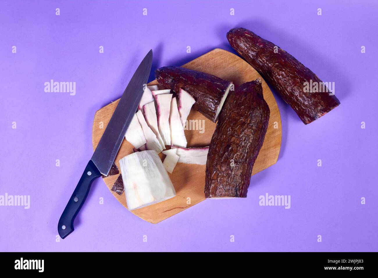 Fresh Organic Cassava Root, Manioc Esculenta, yuca On purple Background ...