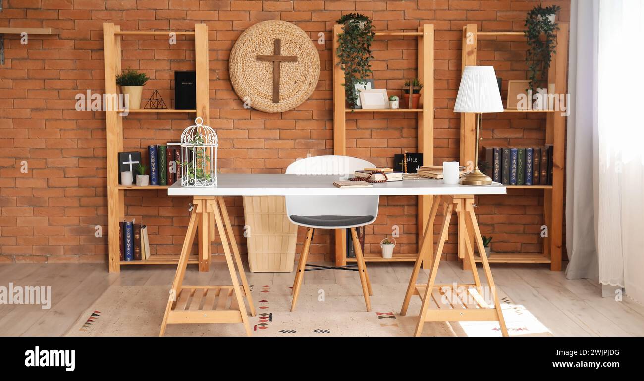 Interior of priest's room with table, chair and shelves Stock Photo - Alamy