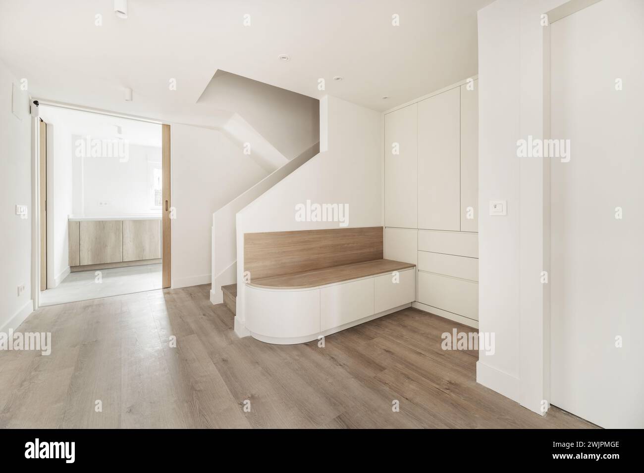 Entrance hall of a single-family house with a wooden seat with large ...