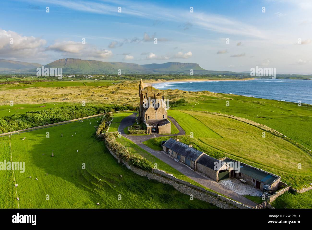 Classiebawn Castle on a backdrop of picturesque landscape of ...
