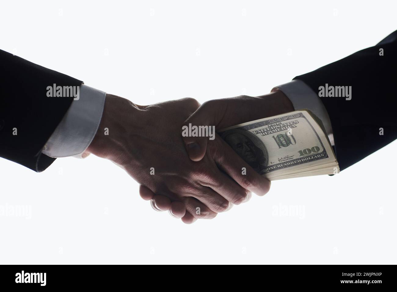 Businessmen's handshake and money transfer. Simple and effective ...