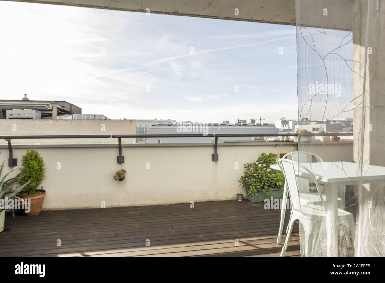 A pretty pastel blue metal garden table with matching chairs on an ...