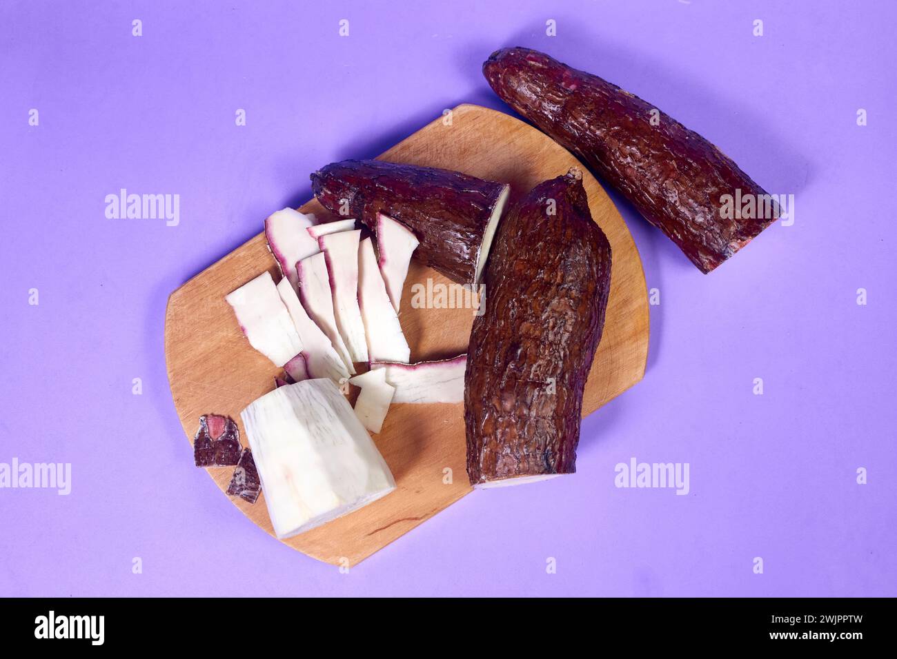 Fresh Organic Cassava Root, Manioc Esculenta, yuca On purple Background ...