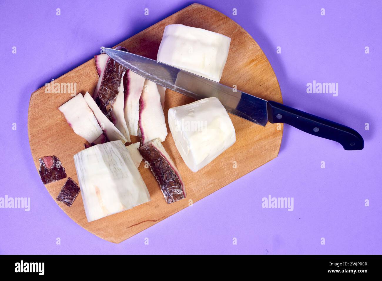 Fresh Organic Cassava Root, Manioc Esculenta, yuca On purple Background ...