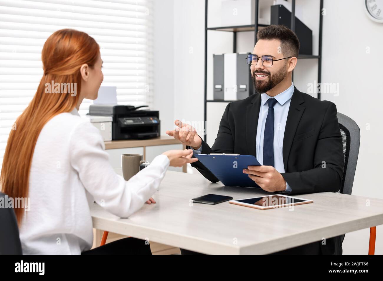 Immigration. Woman having interview with embassy worker in office Stock ...