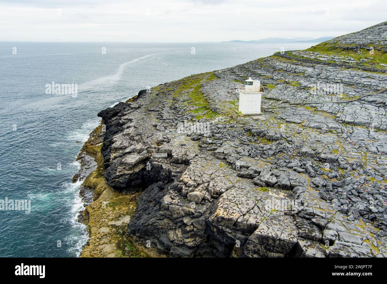 Black Head Lighthouse, situated in the rough rocky landscape of Burren ...
