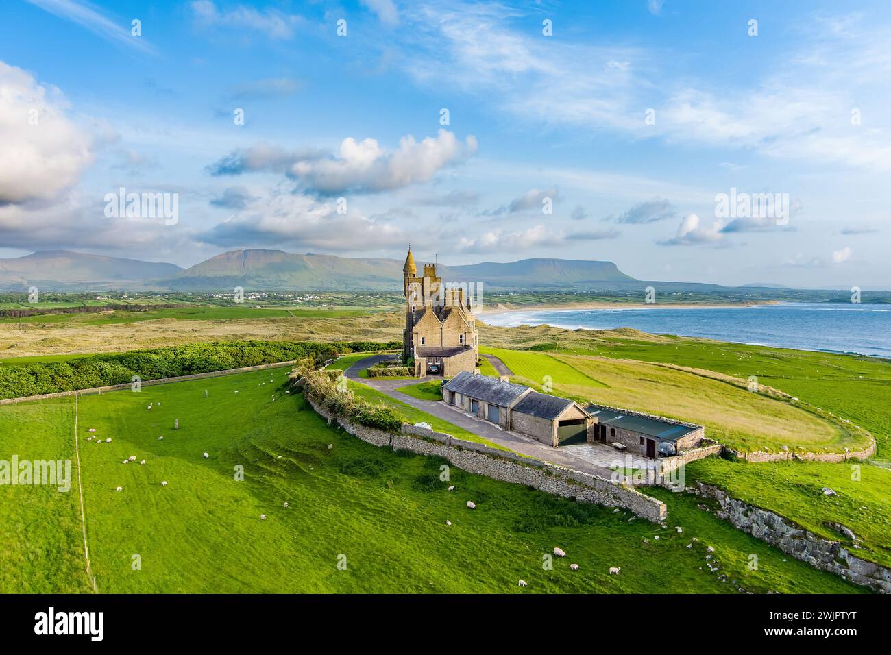 Classiebawn Castle on a backdrop of picturesque landscape of ...