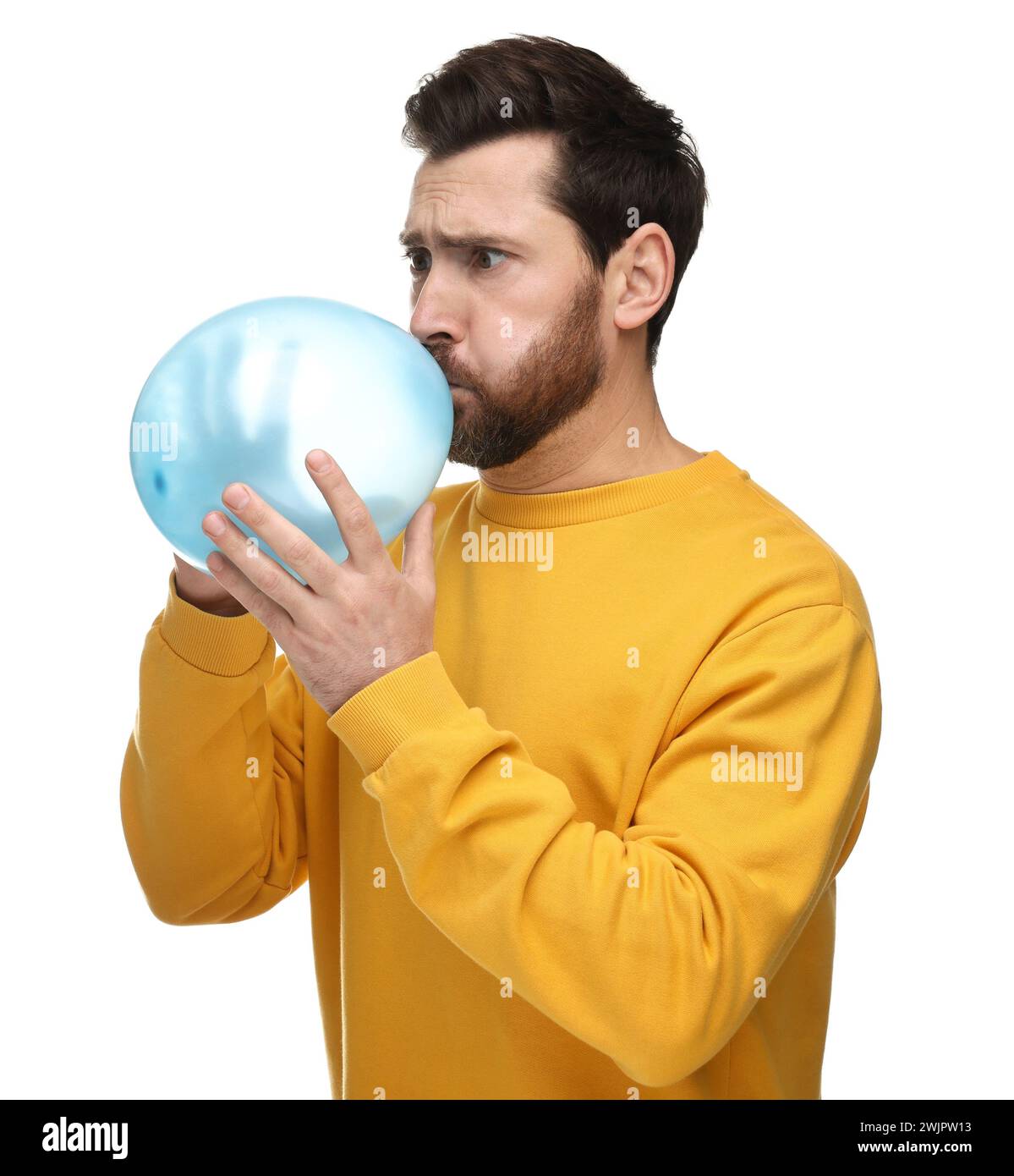 Man inflating light blue balloon on white background Stock Photo - Alamy