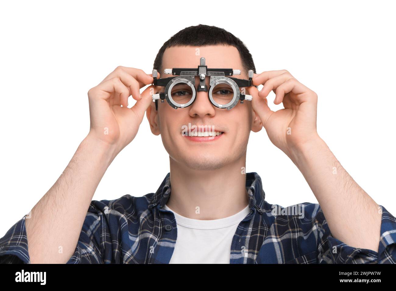 Vision testing. Young man with trial frame on white background Stock ...
