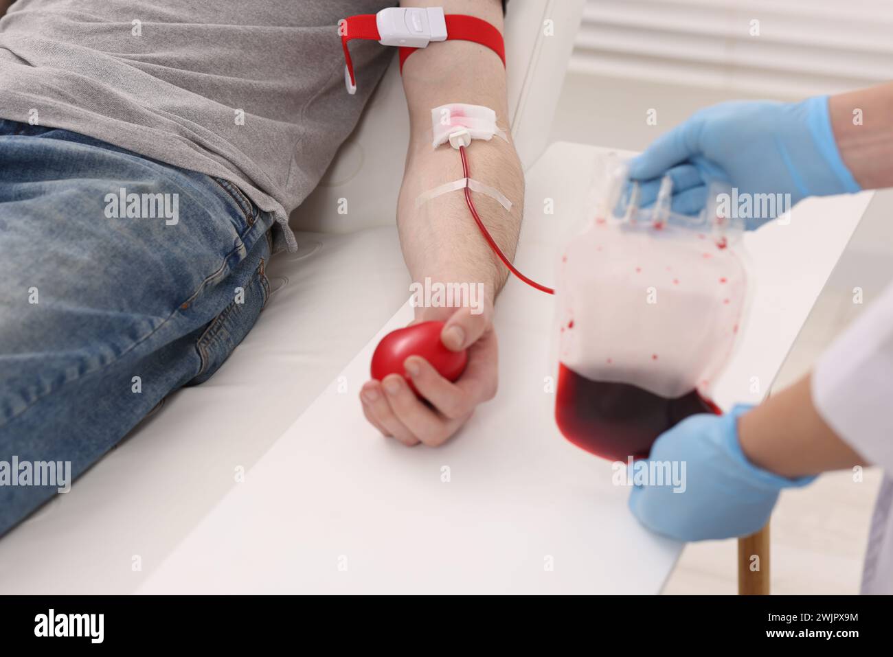 Patient undergoing blood transfusion in hospital, closeup Stock Photo ...