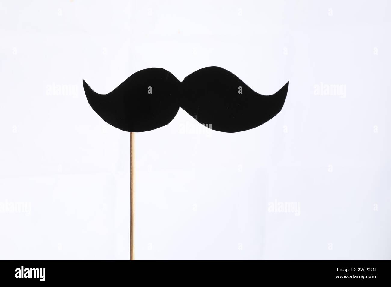 Fake paper mustache party prop against white background Stock Photo - Alamy
