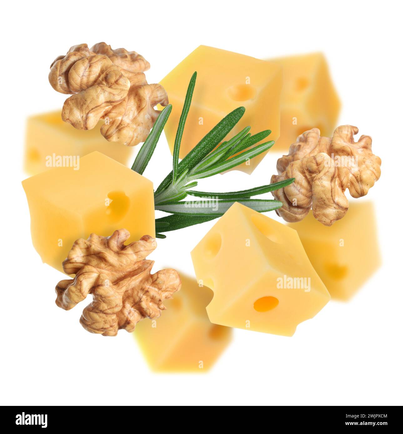 Cheese, walnuts and rosemary flying on white background Stock Photo - Alamy
