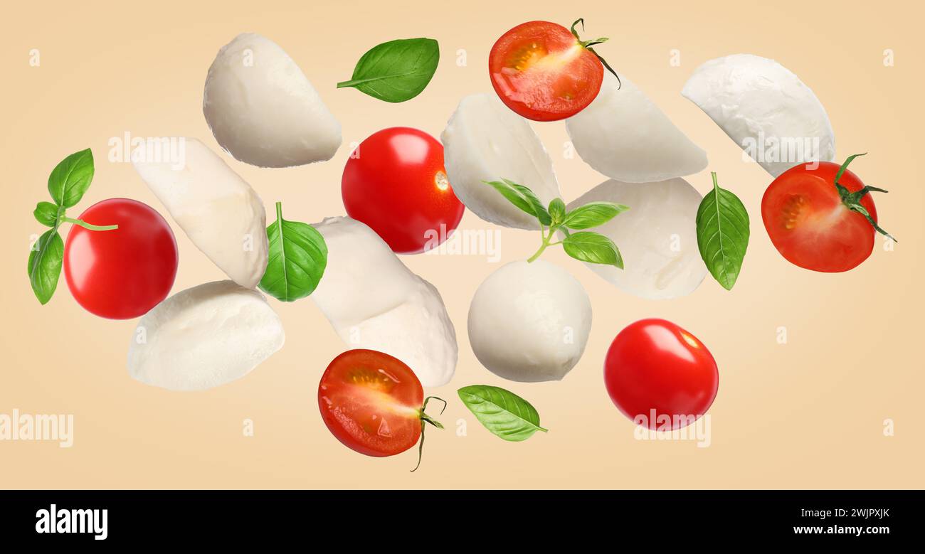 Ingredients for Caprese salad. Mozzarella balls, basil and tomatoes ...