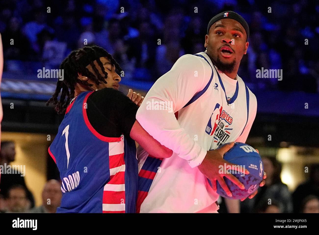 NFL player Micah Parsons is defended by NFL player CJ Stroud during the ...
