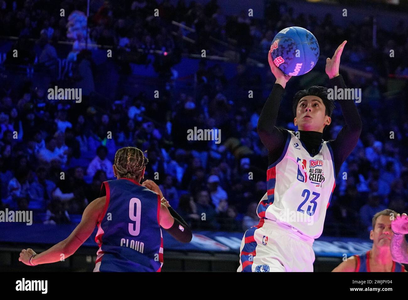 Actor Dylan Wang shoots against WNBA player Natasha Cloud during the ...