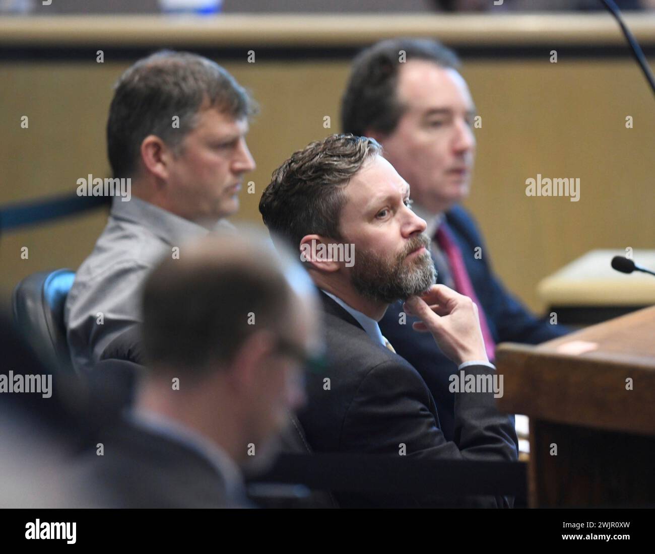 Rise Gold Corp legal counsel Christopher Powell, center right, sits ...