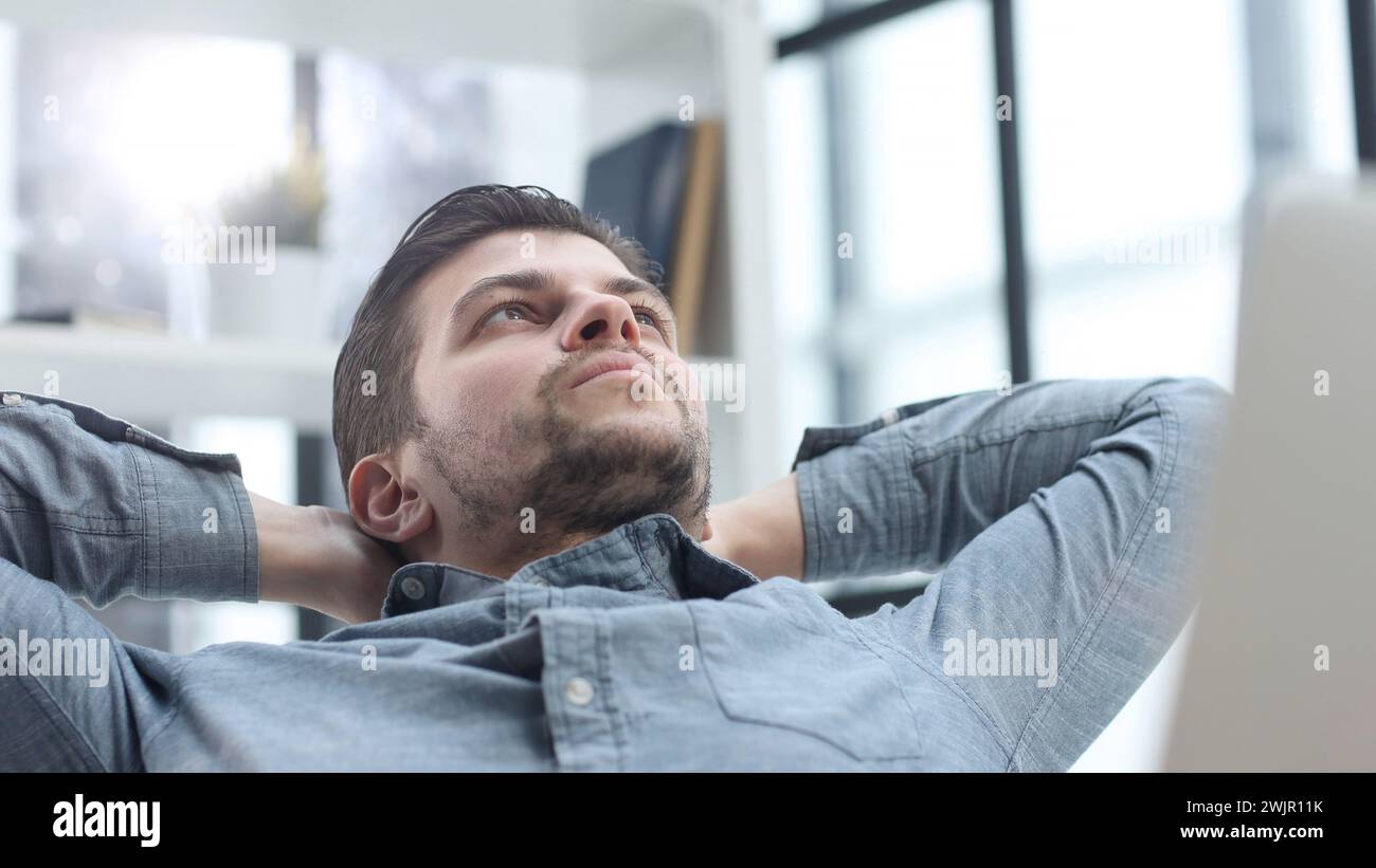 A man uses a laptop in close-up, decided to relax after work Stock ...