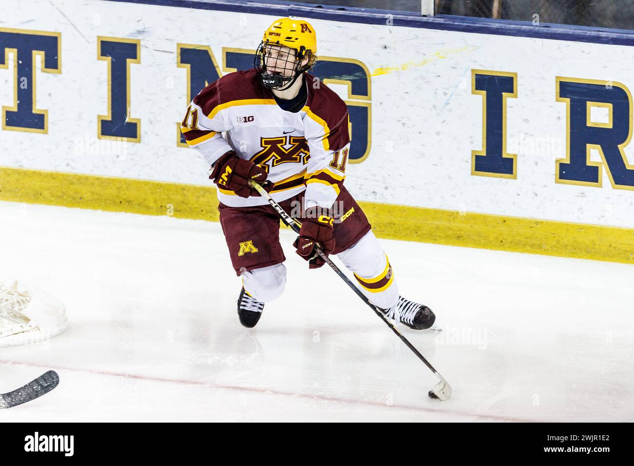 February 16, 2024: Minnesota forward Oliver Moore (11) skates with the ...
