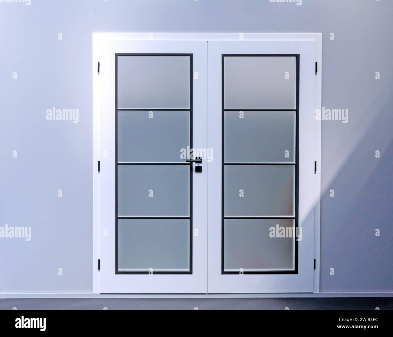 Closed glass doors with handle inside house interior Stock Photo - Alamy