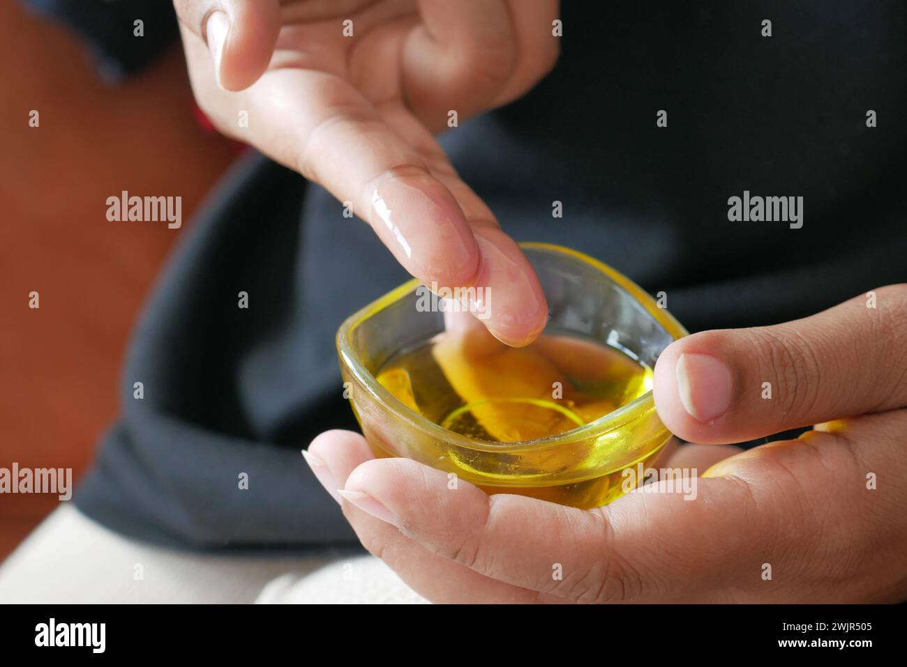 Women hand using olive oil hi-res stock photography and images - Alamy