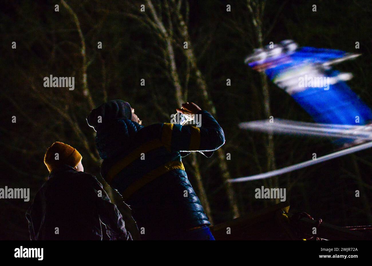 Ty Gibbons, of Marlboro, Vt., and his 11-year-old son Owen watches as ...