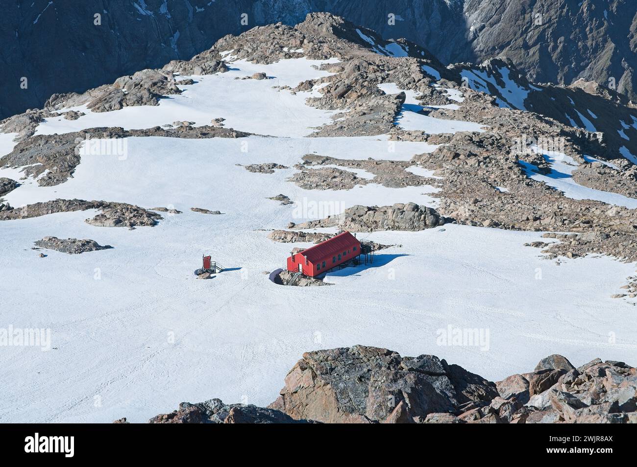 Cozy Red Cabin Amidst Snowy Wilderness: Mueller Hut Nestled in New ...