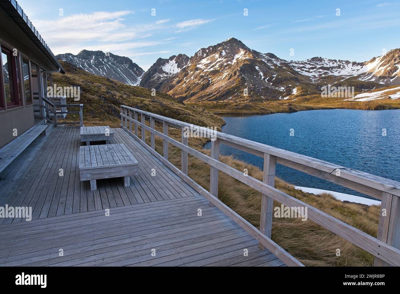 Lakeside Wooden Cabin: Rustic Hut Nestled by the Water with Snowy ...