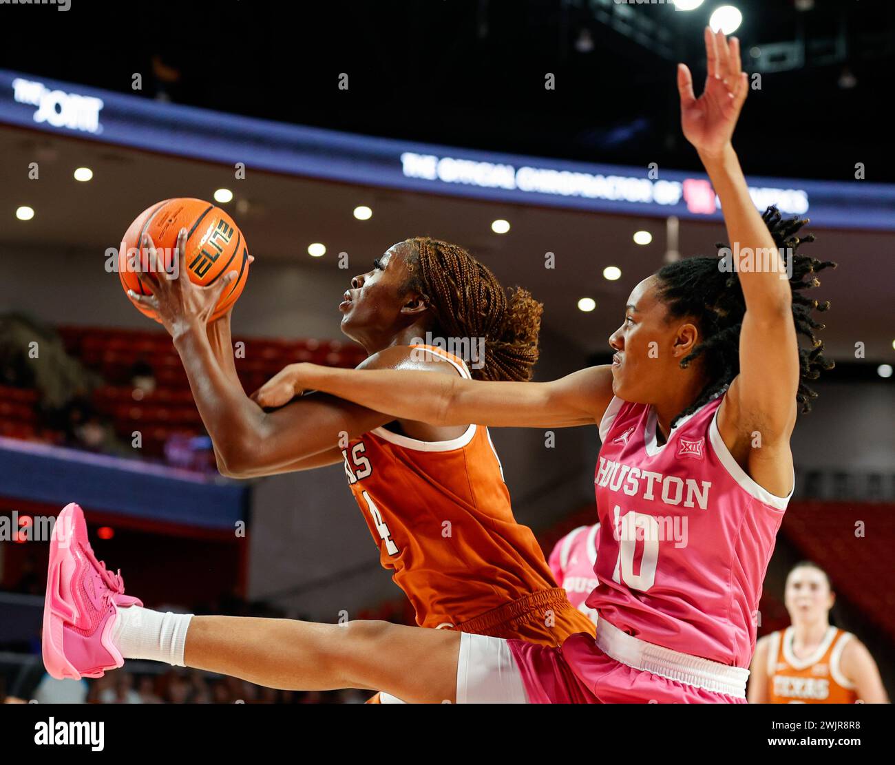 February 14, 2024: Houston guard Britney Onyeje (10) fouls Texas ...
