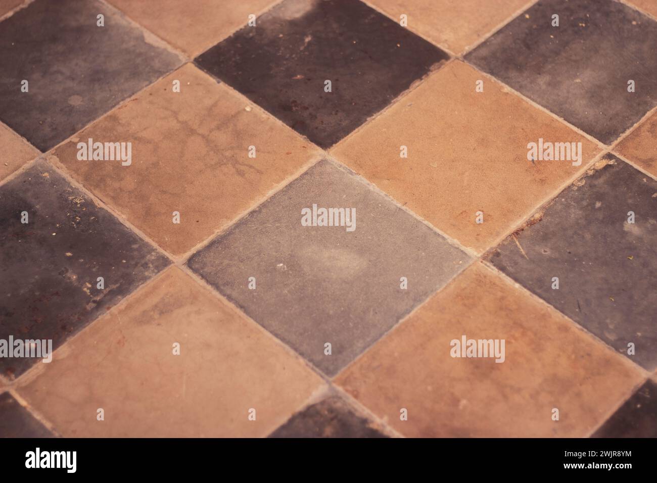 Top view of an old and ornamental decorative tile floor in gray and ...