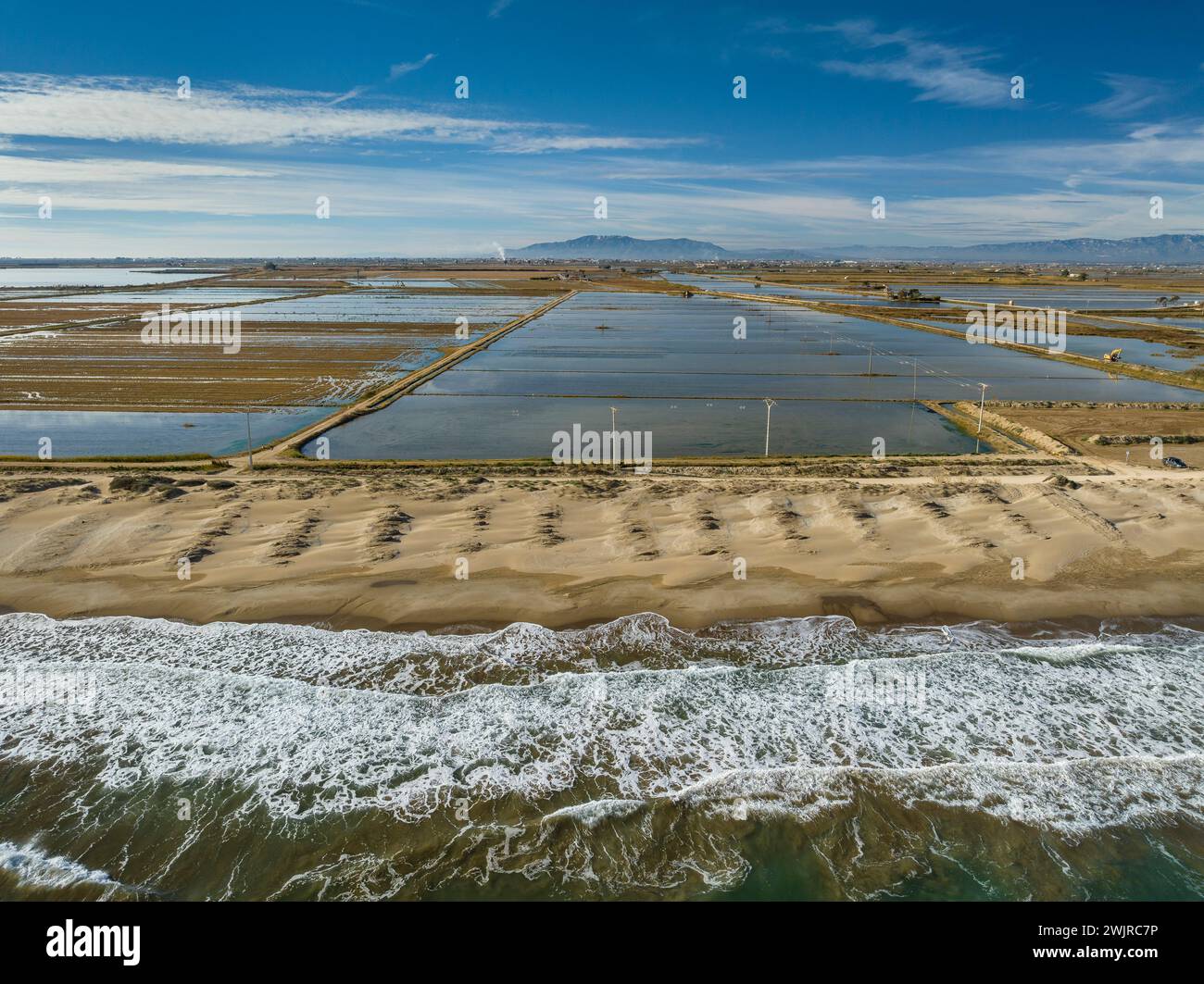 Aerial view of the La Marquesa beach, the dunes and the rice fields of ...