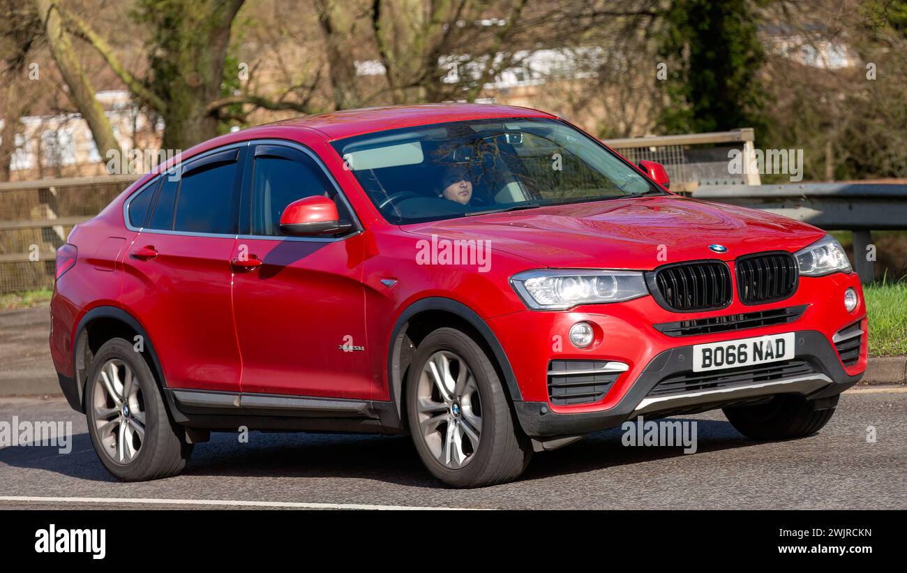 Milton Keynes,UK-Feb 16th 2024: 2016 red diesel engine BMW X4 car ...