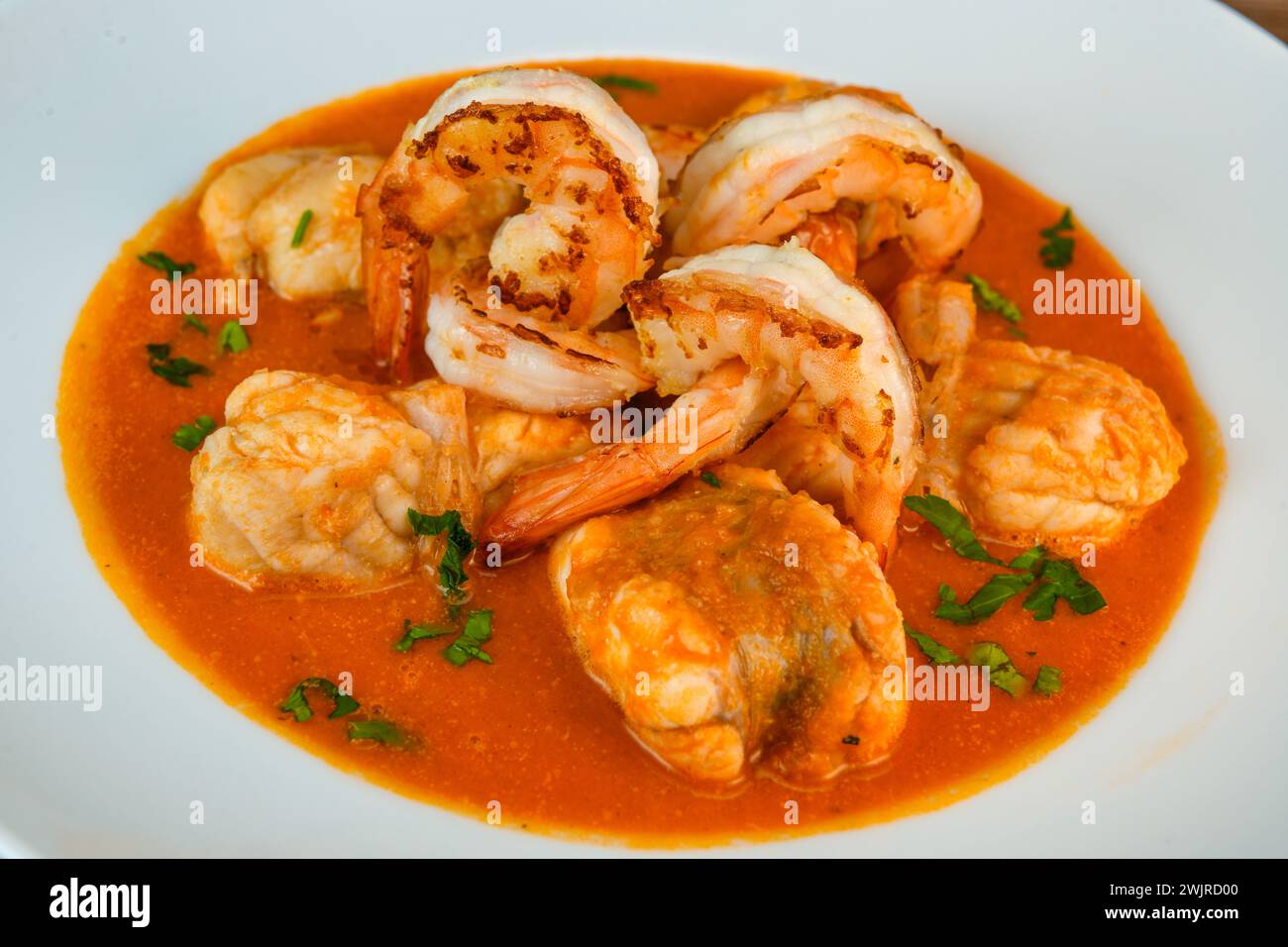 Recipe for Armorican-style monkfish tail, prawns, flambees with cognac ...