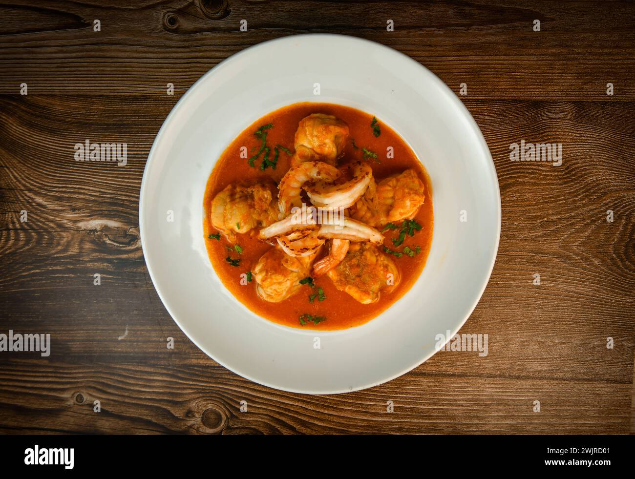 Recipe for Armorican-style monkfish tail, prawns, flambees with cognac ...