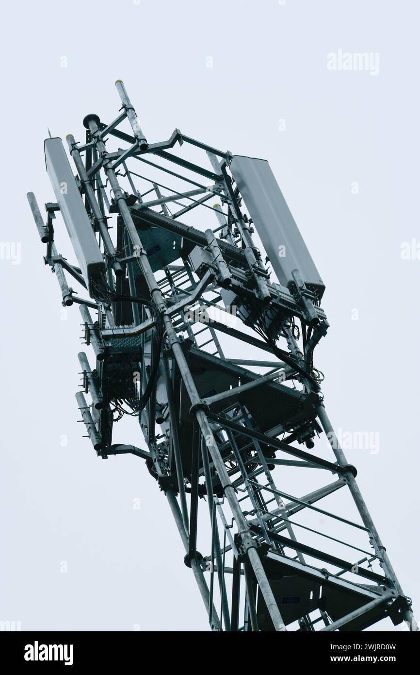 Deployment of the 5G network. Laying antennas on a mobile phone mast in ...