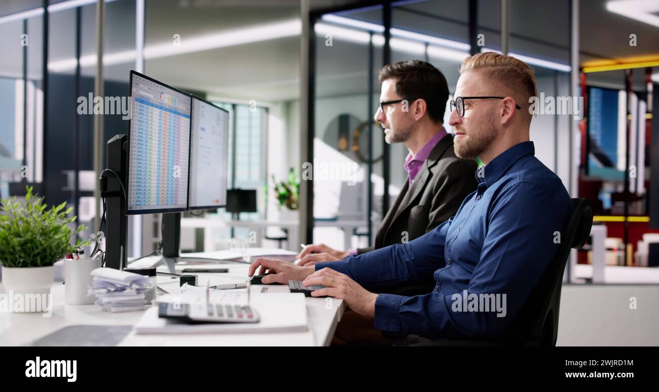 Using Corporate Invoice Spreadsheet On Computer Monitors Stock Photo ...