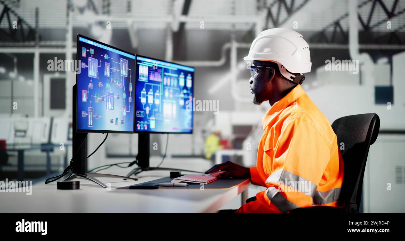 African American Engineer Using Computer In Electric Car Assembly ...
