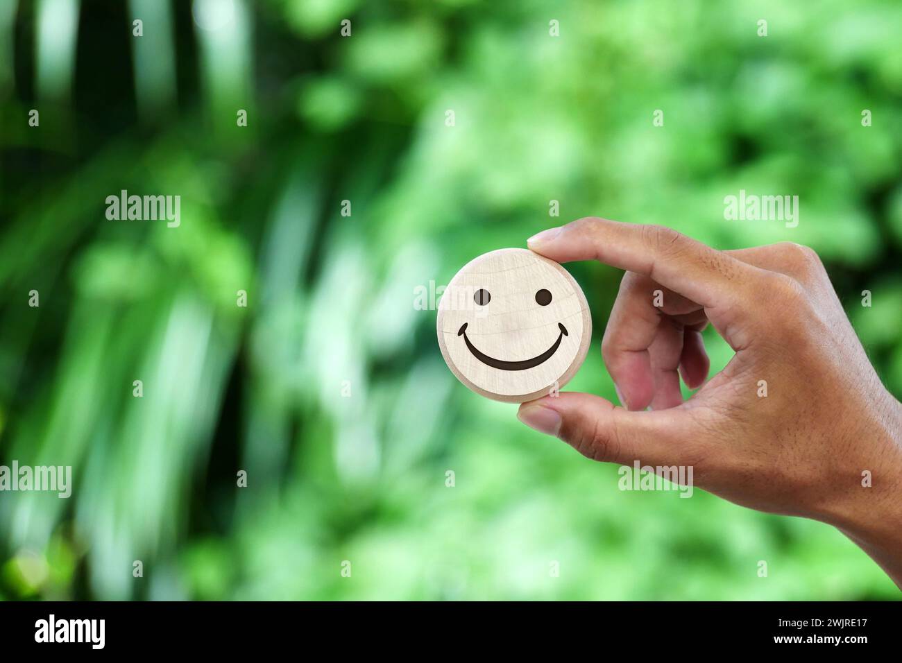 Hand holding wood happy smile face. Concept of positive thinking ...
