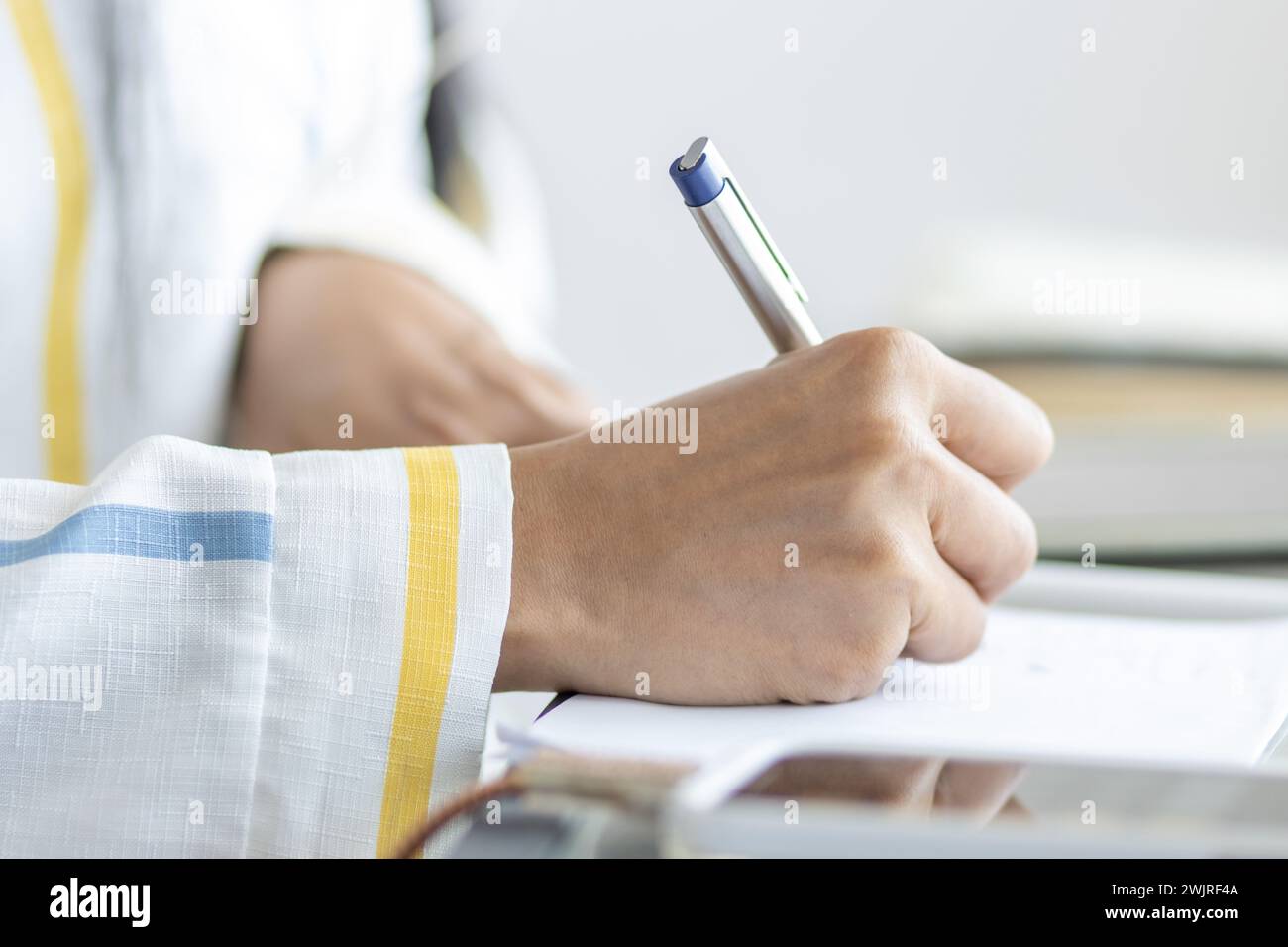 Female student paper pen hi-res stock photography and images - Alamy