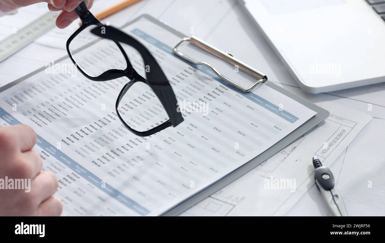 Checking an important business report before a transaction Stock Photo ...