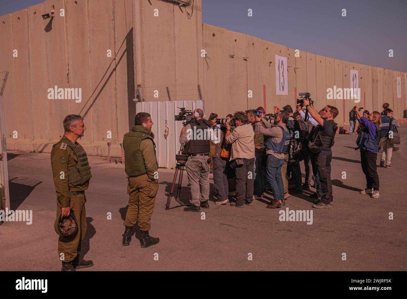 The military personnel oversee international journalists documenting ...