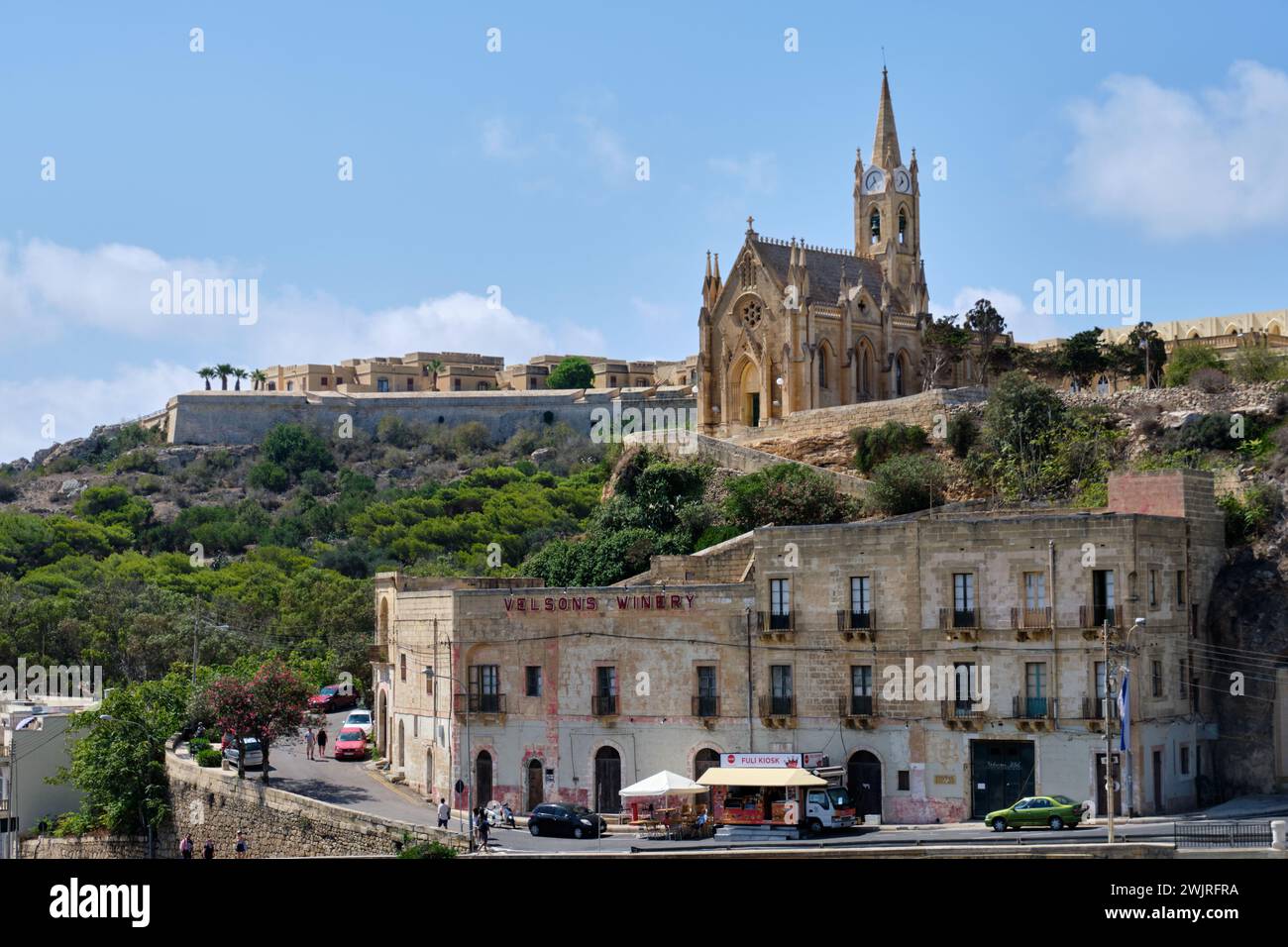 Parish Church of Our Lady of Loreto above the harbour of Mgarr on the ...