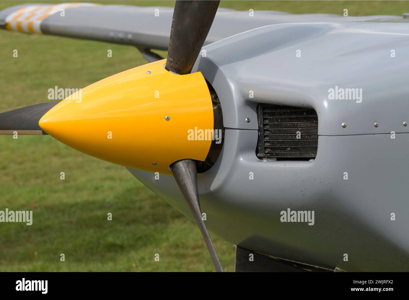 Fragment of the front part of a light aircraft with a propeller. Close ...