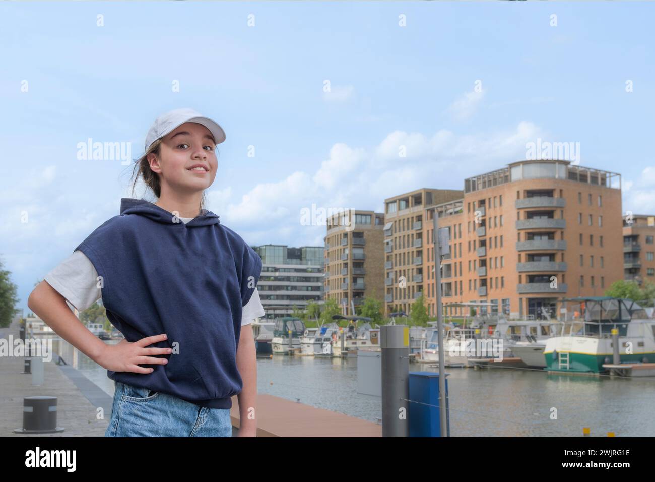 On the pier with yachts in summer. teenage girl in fashionable youth ...