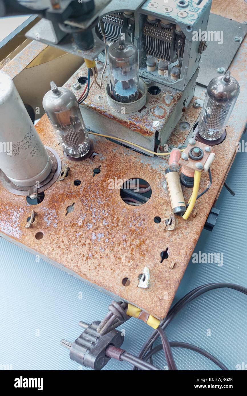 Parts of an antique radio with traces of time. Radio tubes, transistors ...