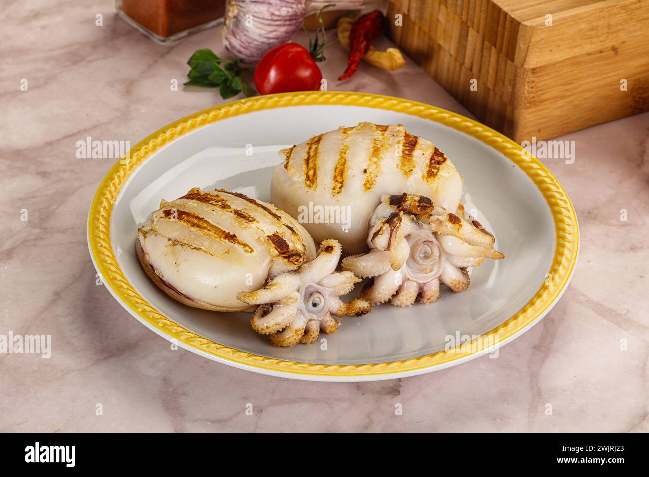 Grilled gourmet cuttlefish in the plate Stock Photo - Alamy