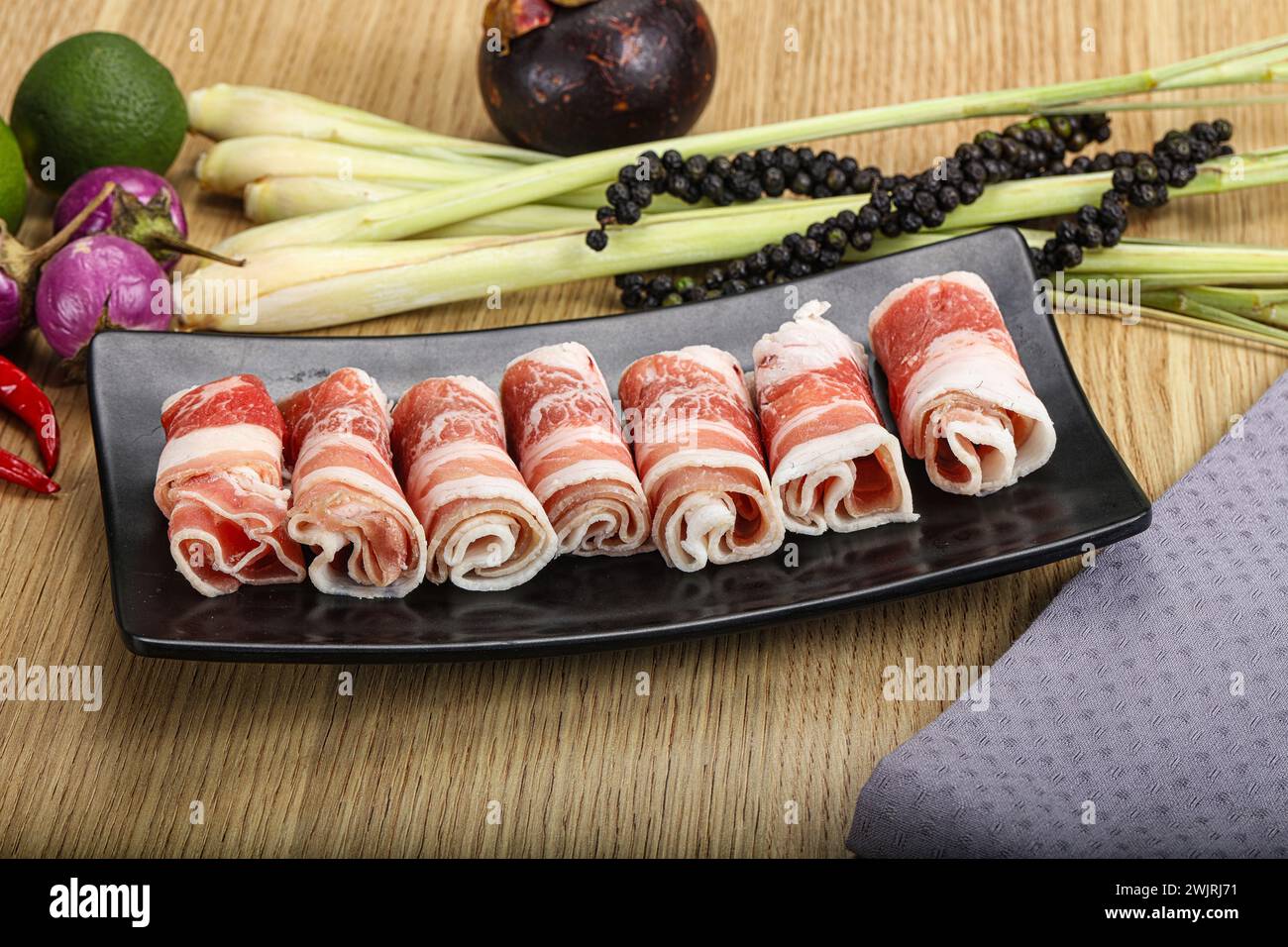 Raw beef bacon roll for grill Stock Photo - Alamy