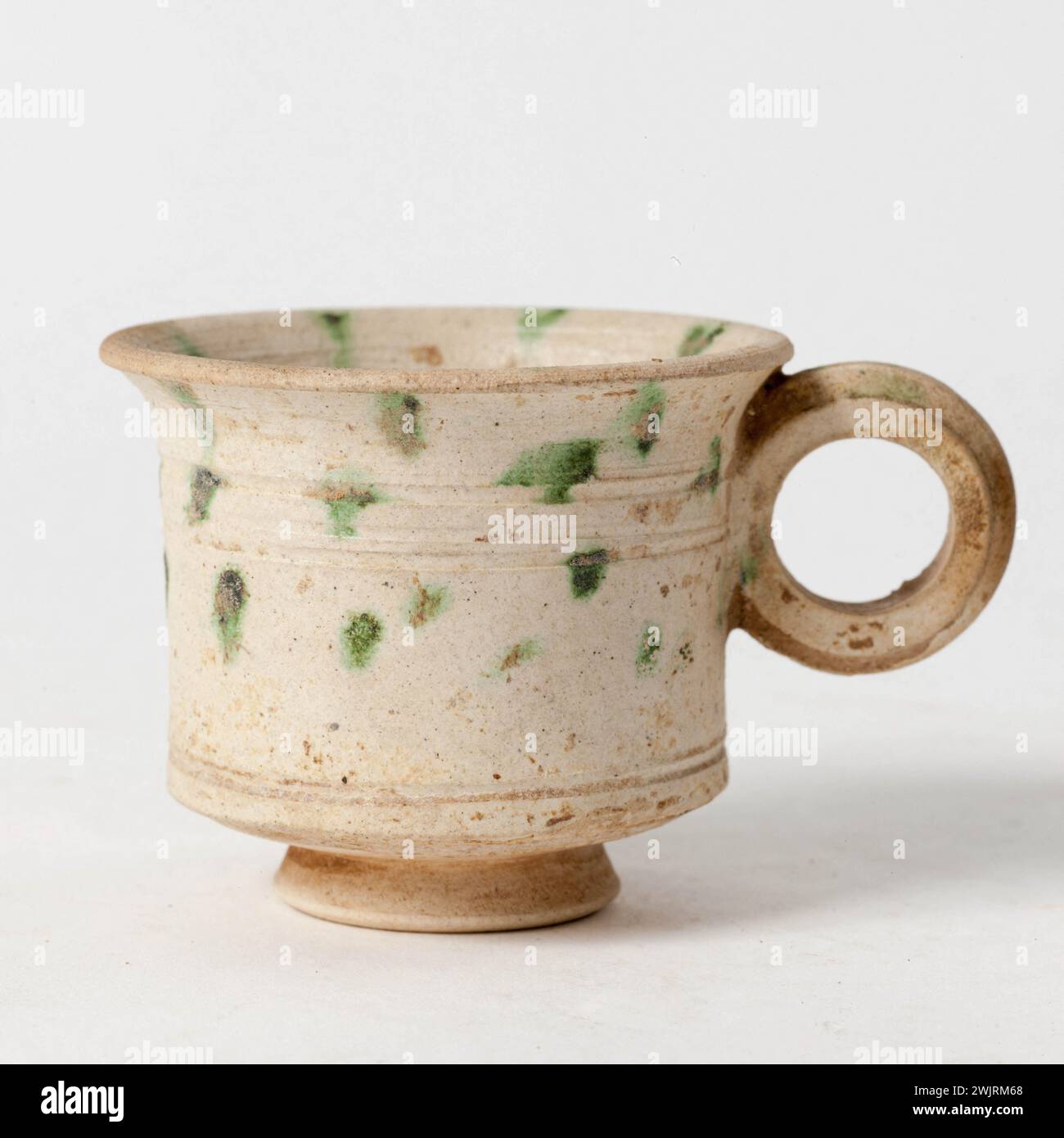 Cup ". Terracotta spotted with green glaze. China, Tang Dynasty (618 ...